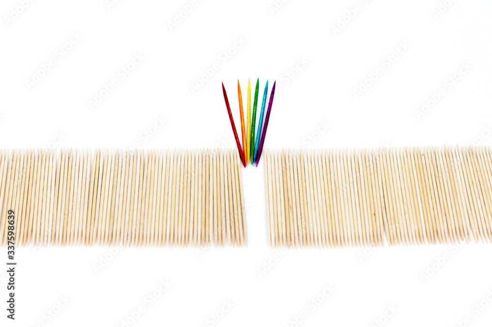 Large number of toothpicks lined up in a long row, with rainbow colored ...