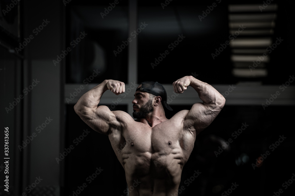 handsome active strong bearded caucasian man in cap showing double ...