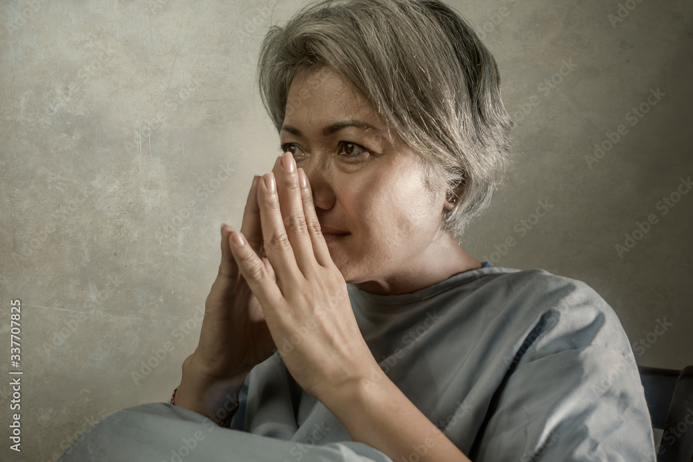 dramatic portrait of attractive sad and depressed mature woman with ...