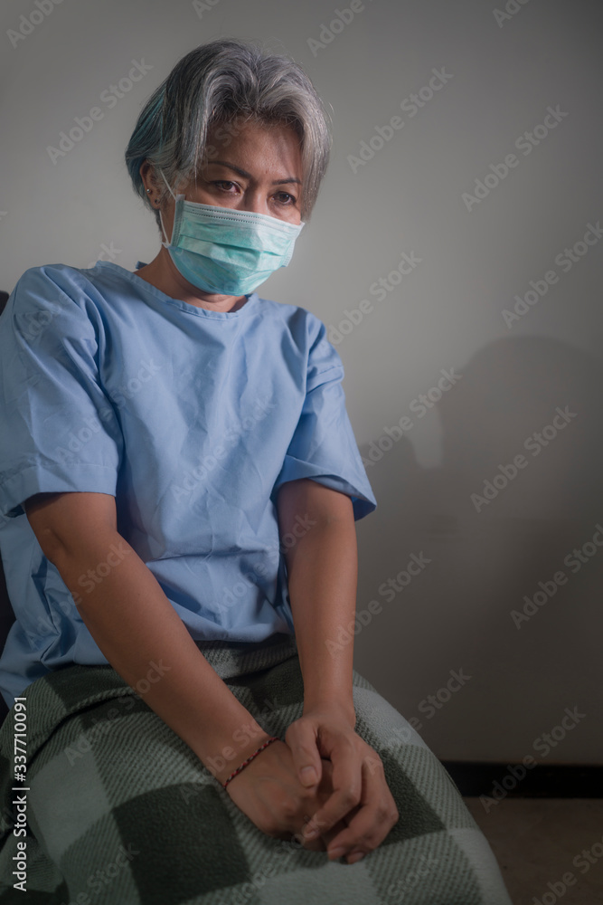 covid-19 virus spreading disease - scared and sad mature woman with ...