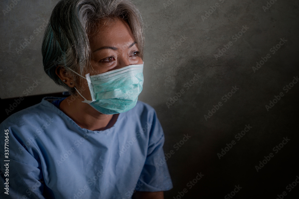 covid-19 virus spreading disease - scared and sad mature woman with ...