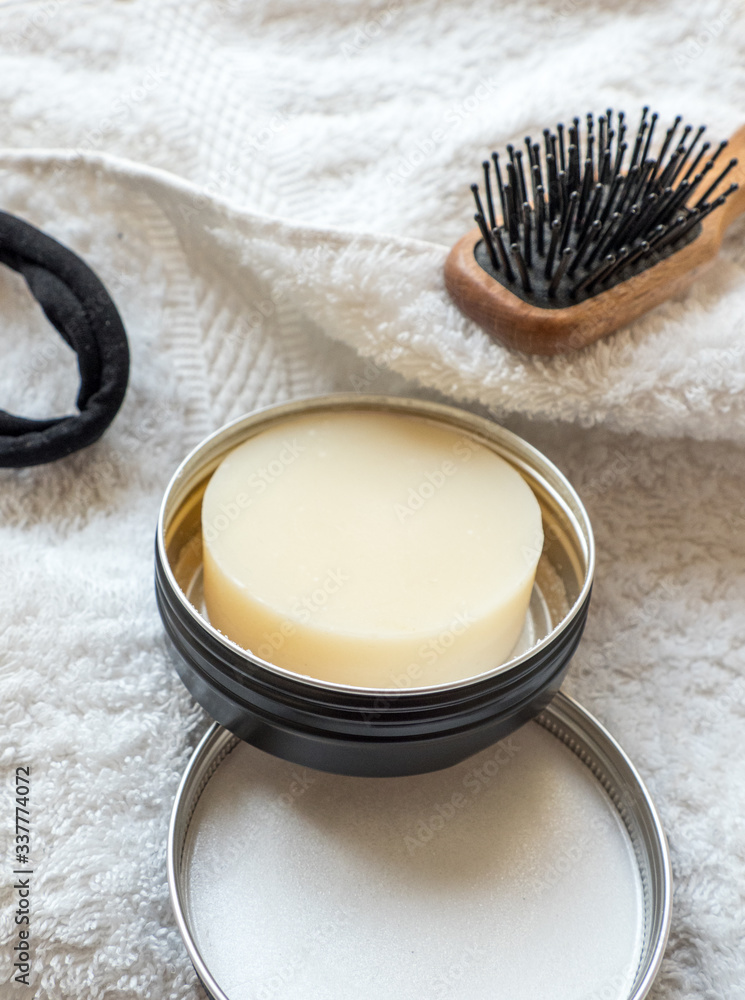 Solid, plastic free Shampoo bar in a round metal container Stock Photo ...