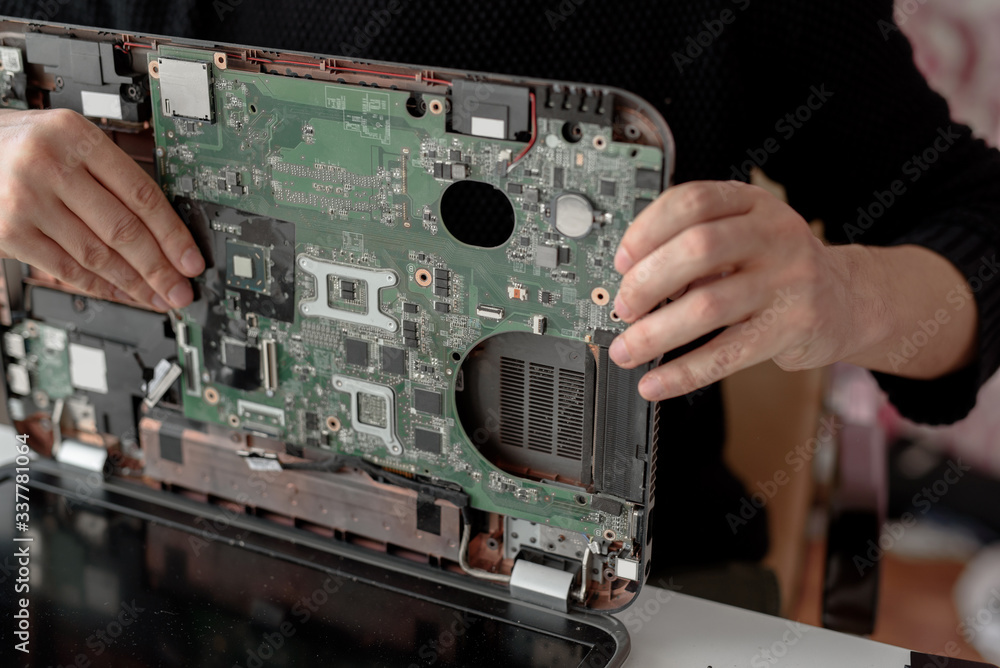 Laptop repair. Disassembled computer parts. PC electronic components ...
