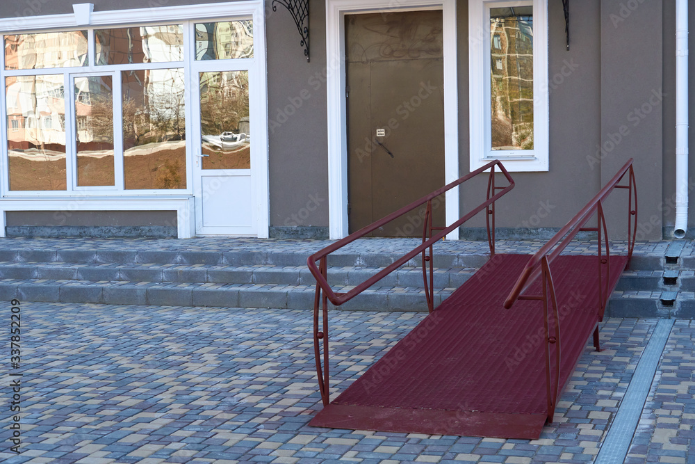 Wheelchair access ramp for entrance of residential multistory building ...