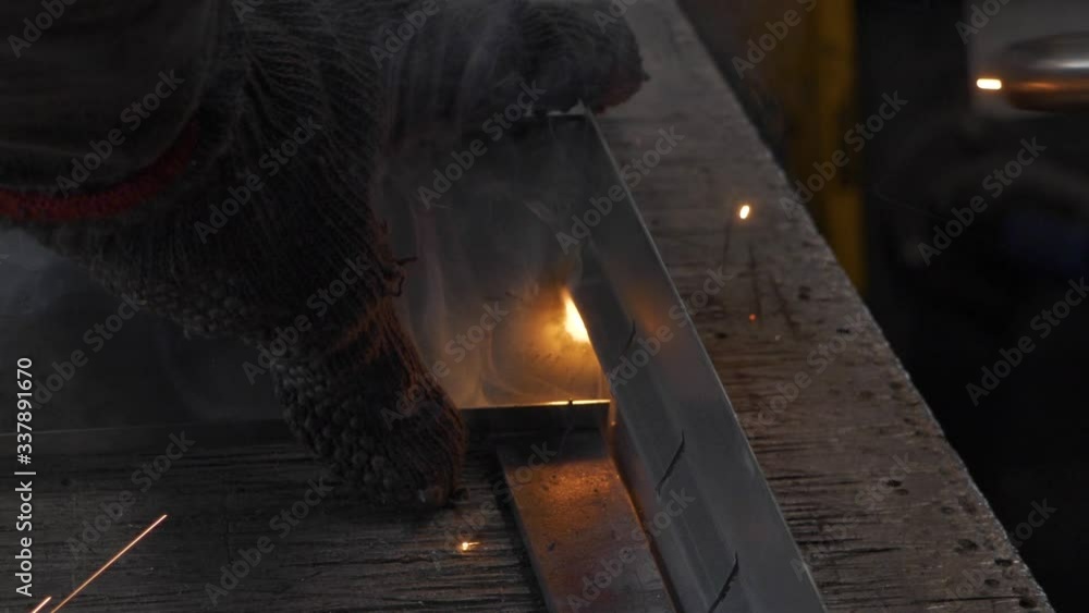 Welder works in metal construction - construction and processing of ...