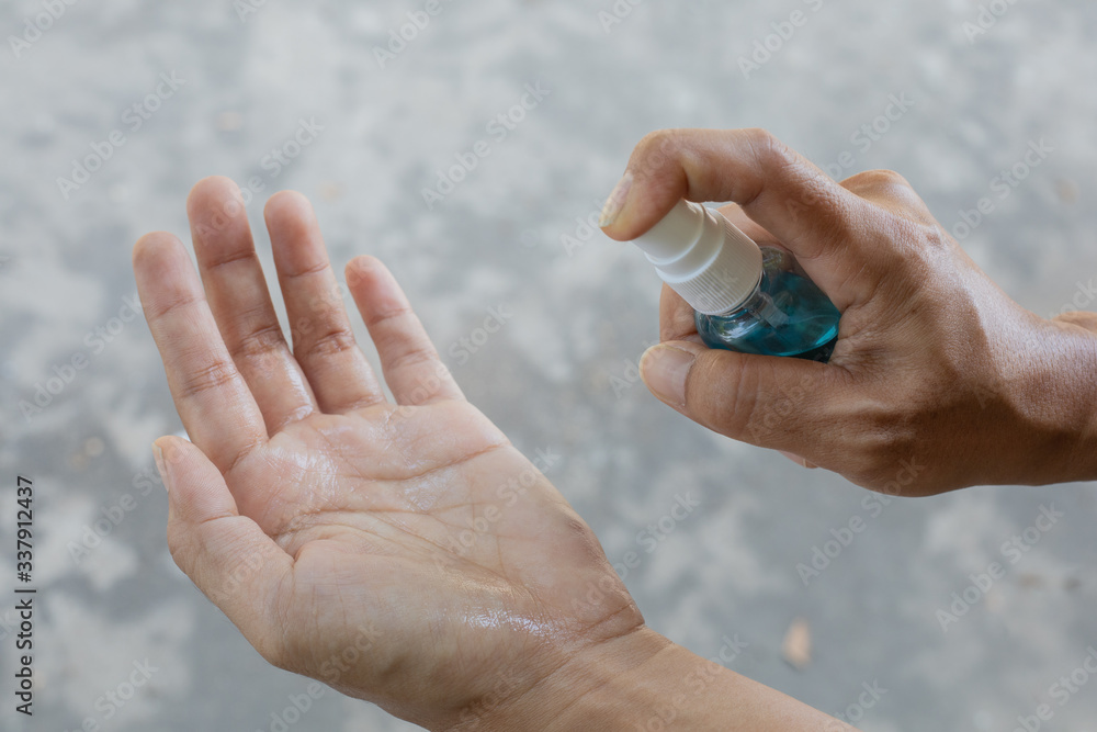 Hands spraying alcohol hand for disinfection hygiene and protection ...