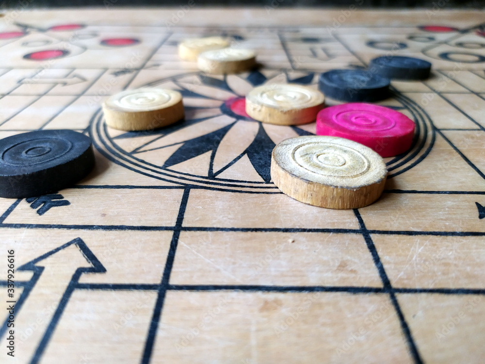 Carrom board or Karrom , carrom men, and queen. Close up Stock Photo ...