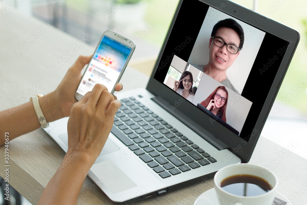 Asian business man talking to her colleagues about plan in video ...