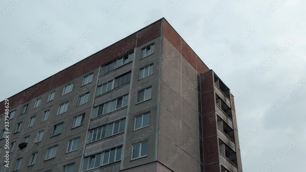 Architecture of authentic Soviet buildings, view of a gray residential ...