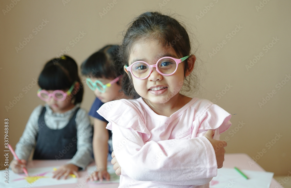 confident student child girl wearing glasses standing in front of ...