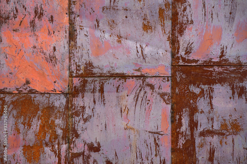 Rusty wall made of tin sheets forming an up-going chart. Red rust ...