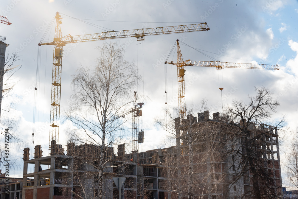 Tower building cranes build new multi-storey houses from monolithic ...