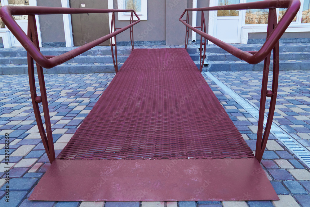 Wheelchair access ramp for entrance of residential multistory building ...