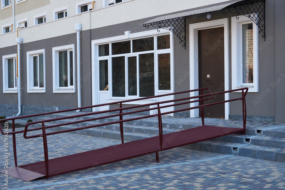 Wheelchair access ramp for entrance of residential multistory building ...