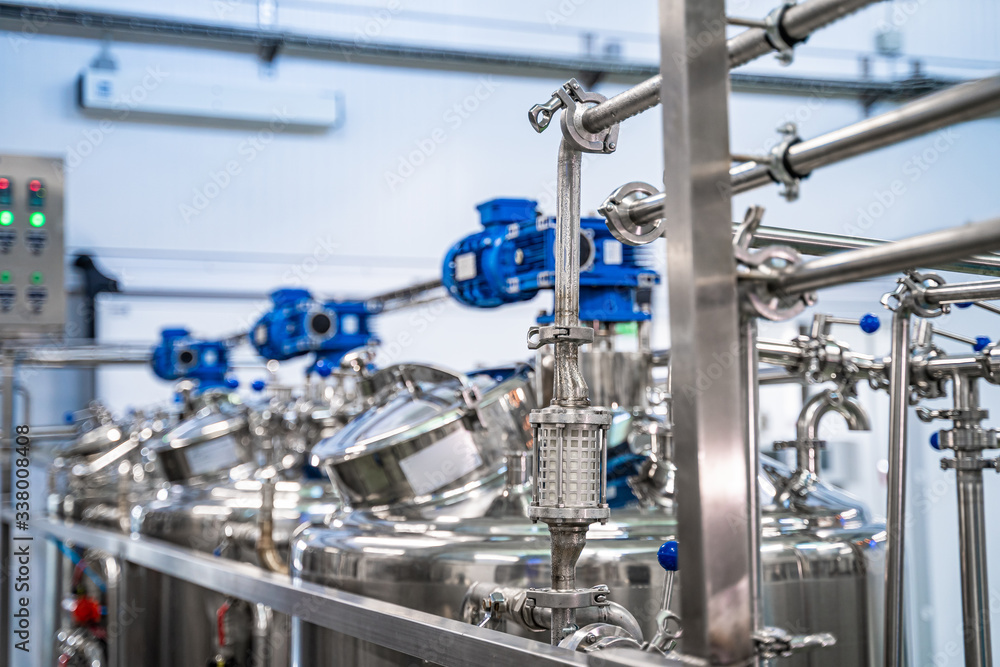 General view of the interior of a milk factory. Equipment at dairy ...