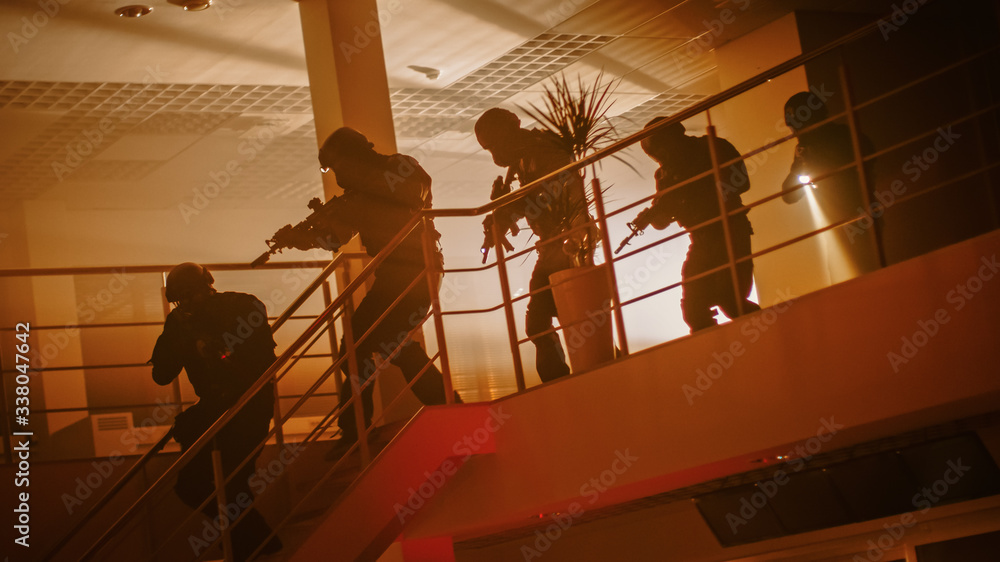 Masked Squad of Armed SWAT Police Officers Run Down the Stairs from a ...