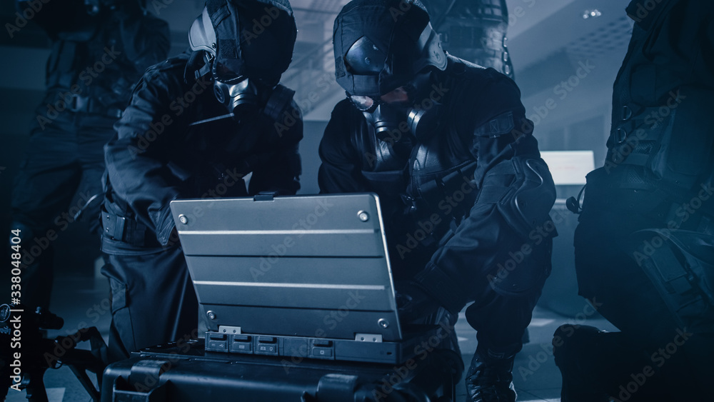 Masked Team of Armed SWAT Police Officers with Rifles are in Dark ...