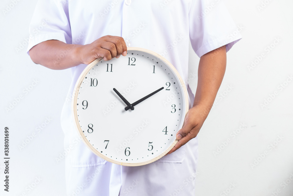 Young man doctor white uniform withholding time clock in the hospital ...