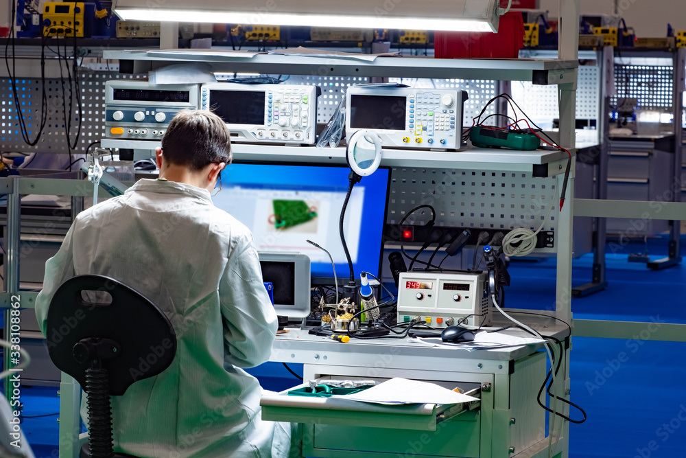 Laboratory for the development of the conveyor line. Engineer at work ...