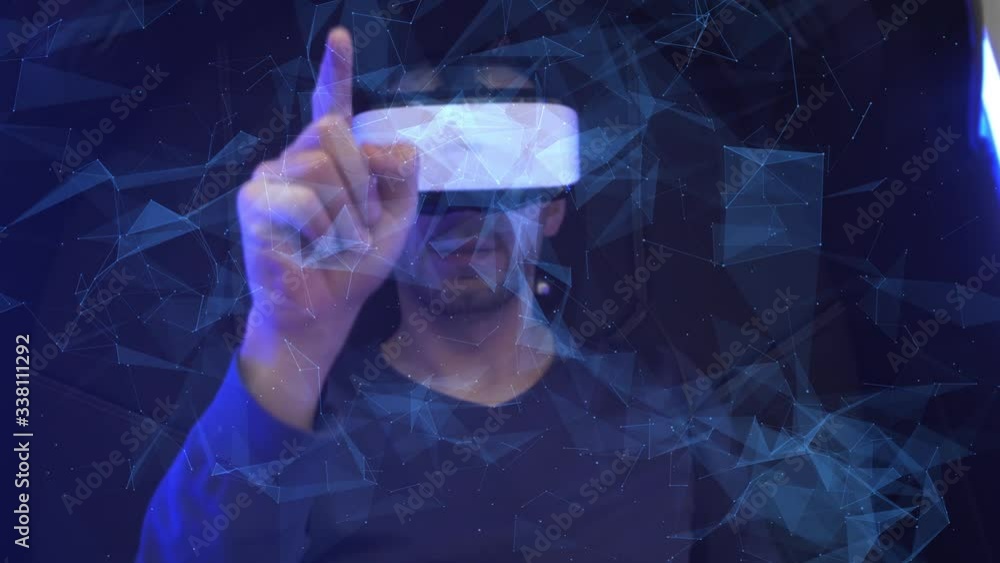 Model young man in glasses of virtual reality on dark background ...