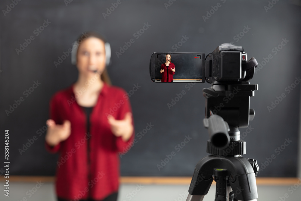 Young woman teacher is filming movie for online education. Stock Photo ...