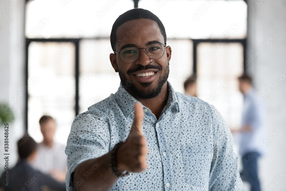 Smiling African American male recruiter stretch hand greeting getting ...