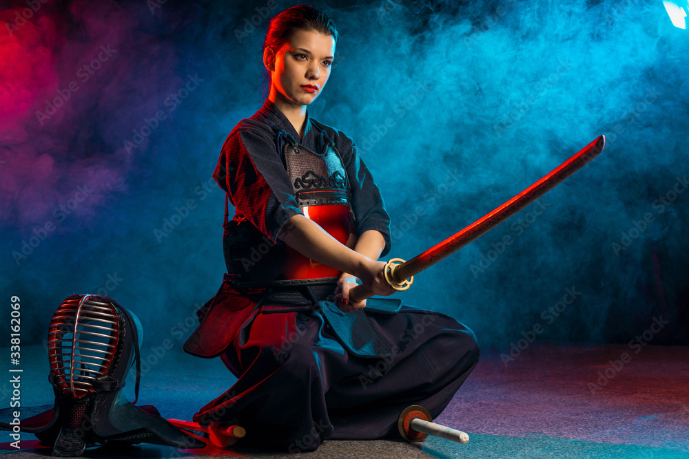 strong caucasian kendo fighter in traditional clothes. japanese martial ...