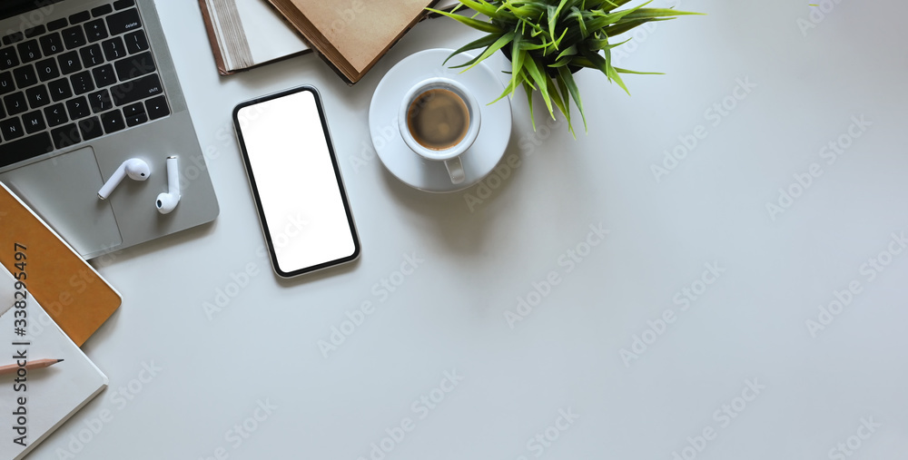 Top view image of smartphone with white blank screen putting on white ...