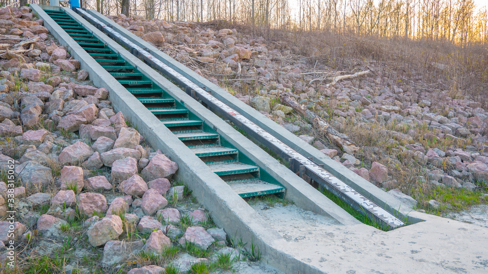 Water level indicator pole at the river. Water level meter on the ...