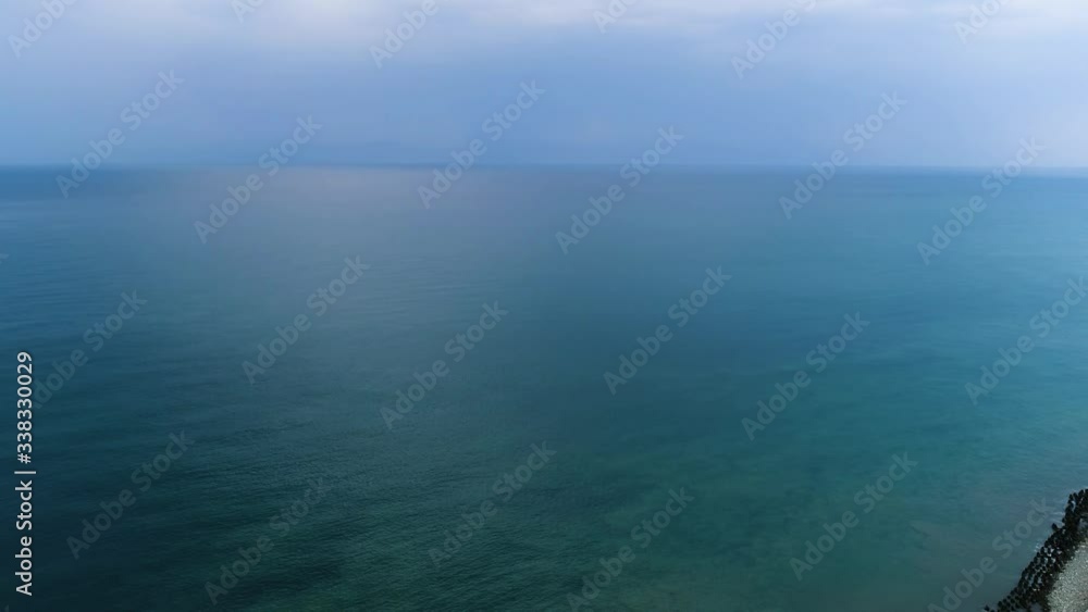 Stunning aerial view of the endless turquoise ocean with the line of ...