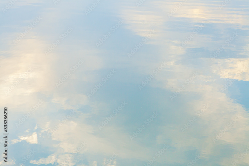Clouds reflecting in the water. Texture. Sky reflection on the surface ...