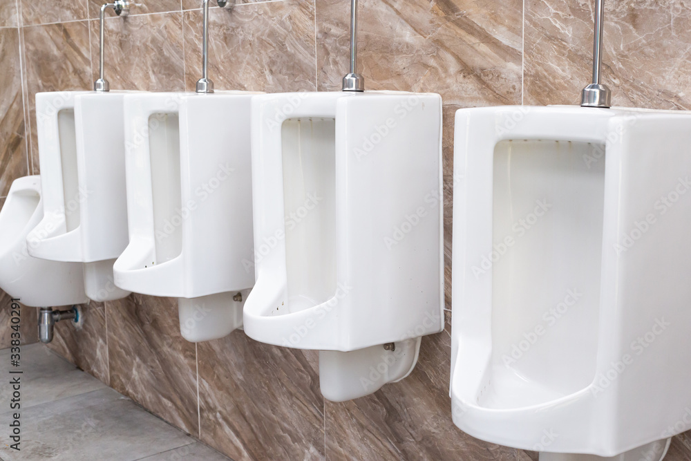 Men's white urinals design, Close up row of outdoor urinals men public ...
