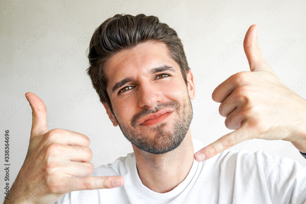 Portrait of a young joyful and cool guy with extremely happy emotion on ...