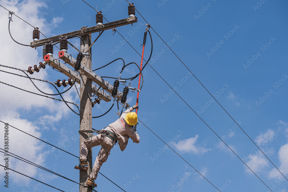 The power lineman use clamp stick (insulated tool) to closing a ...