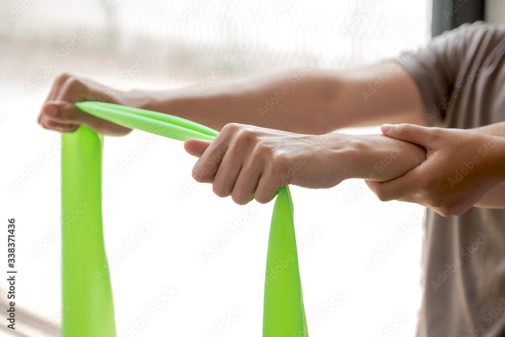 Female physiotherapists are helping male patients with arm injuries ...