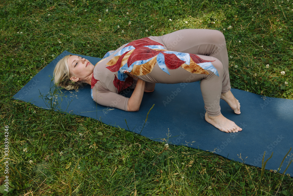 Variation of ardha chakrasana half wheel pose by woman in gymnastic ...