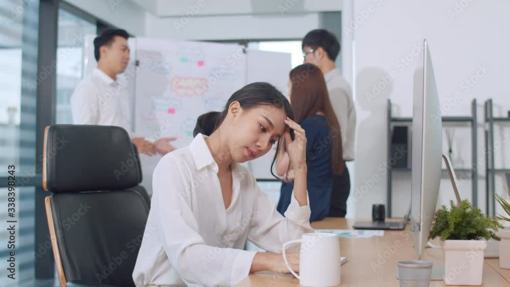Millennial young Chinese businesswoman working stress out with project ...