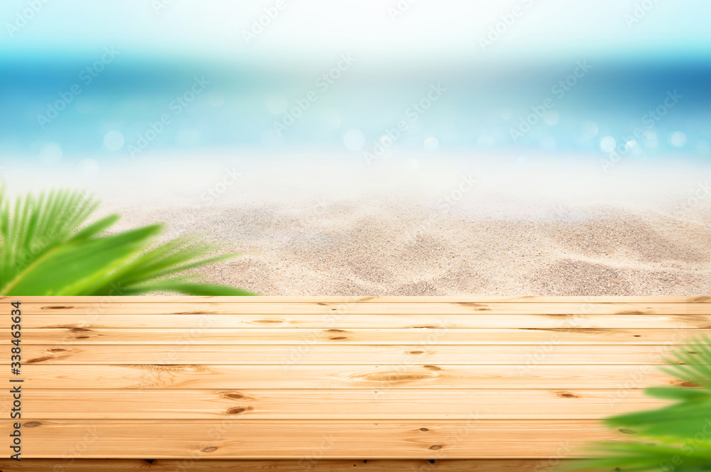 Beautiful Summer background woodent table top and blur sea sandy beach ...