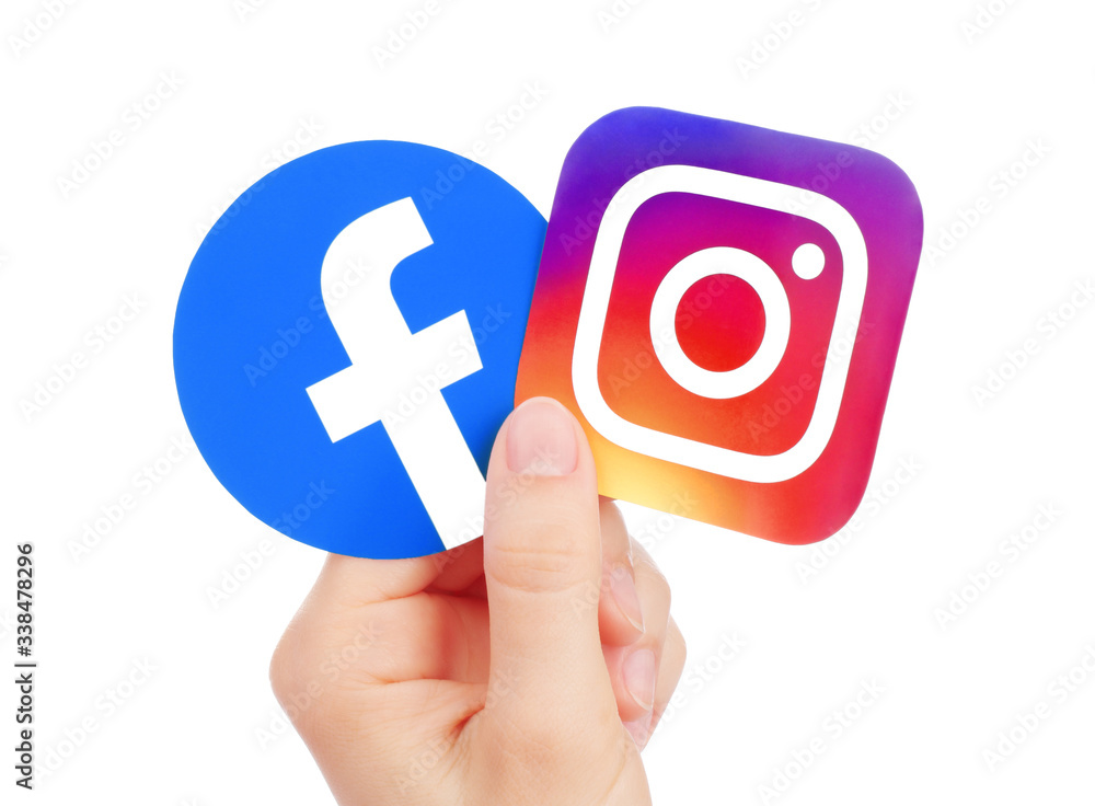 Hand holds new Facebook logo and Instagram Stock Photo | Adobe Stock