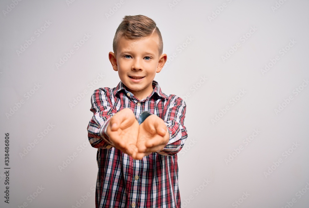 Young little caucasian kid with blue eyes wearing elegant shirt ...