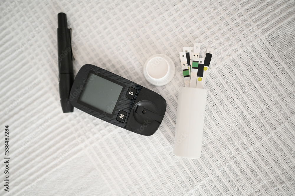 Close up shot of diabetic set of lancet with spare needles, glucometer ...