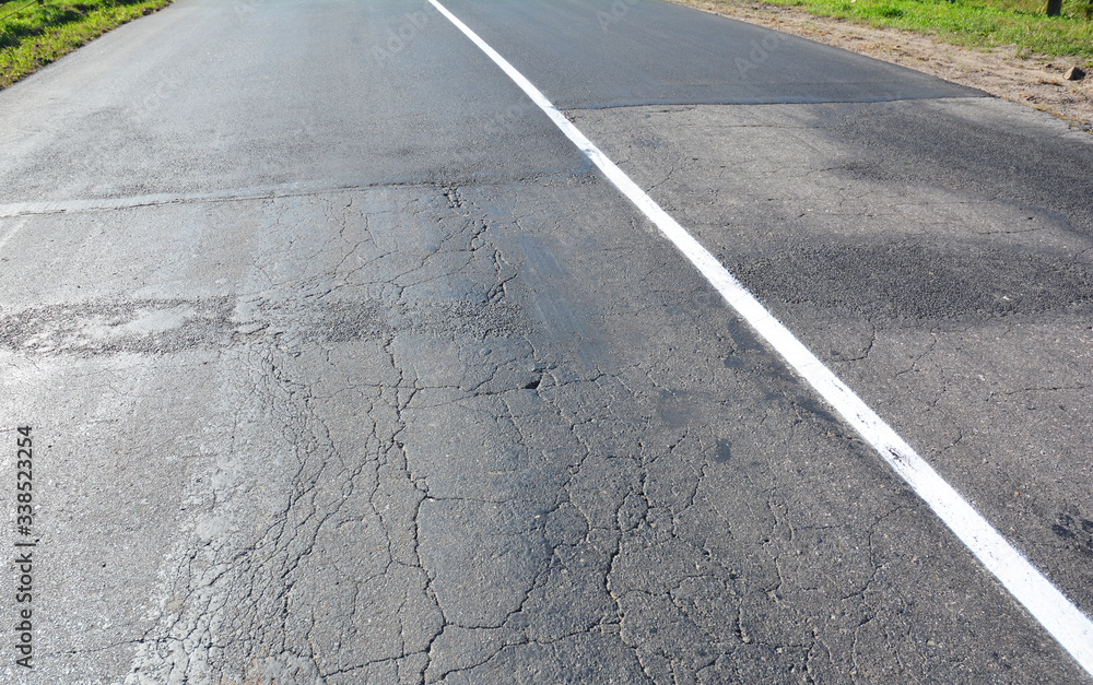 Rural asphalt road damage, heavy trucks cause cracks on roads and ruin ...