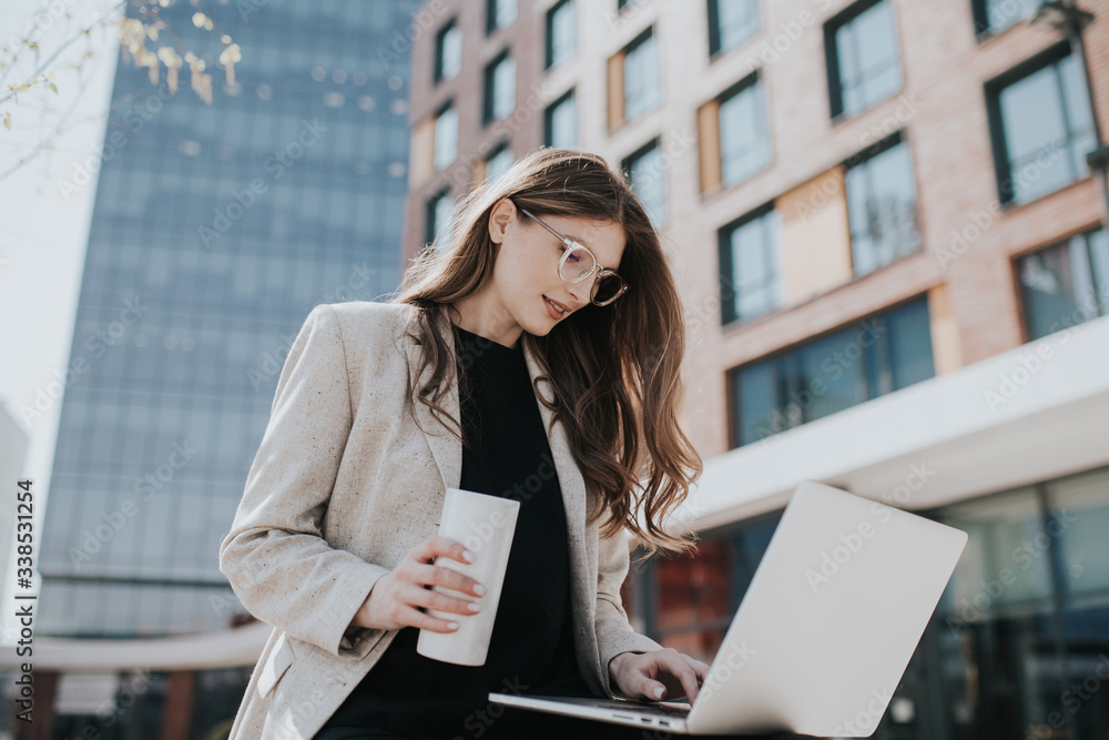 Beautiful smiling lady with laptop and cup of coffee. Female influencer ...