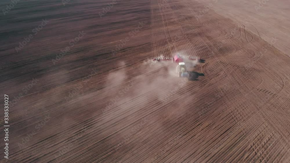 Process of sowing cereals and other crops. Beautiful drone view of a ...