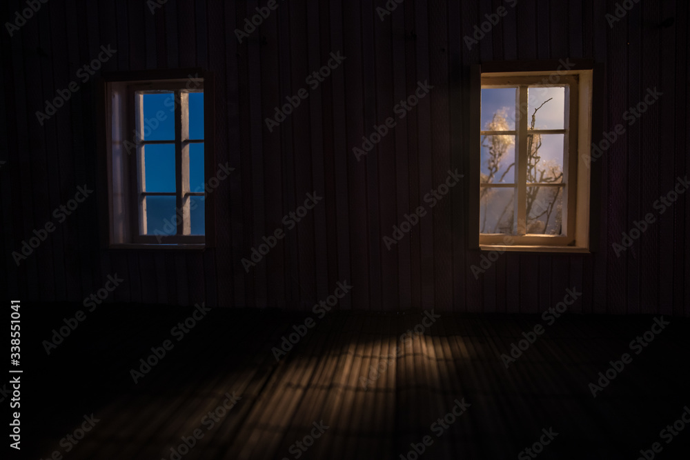 Night scene of moon seen through the window from dark room. Moonlight ...