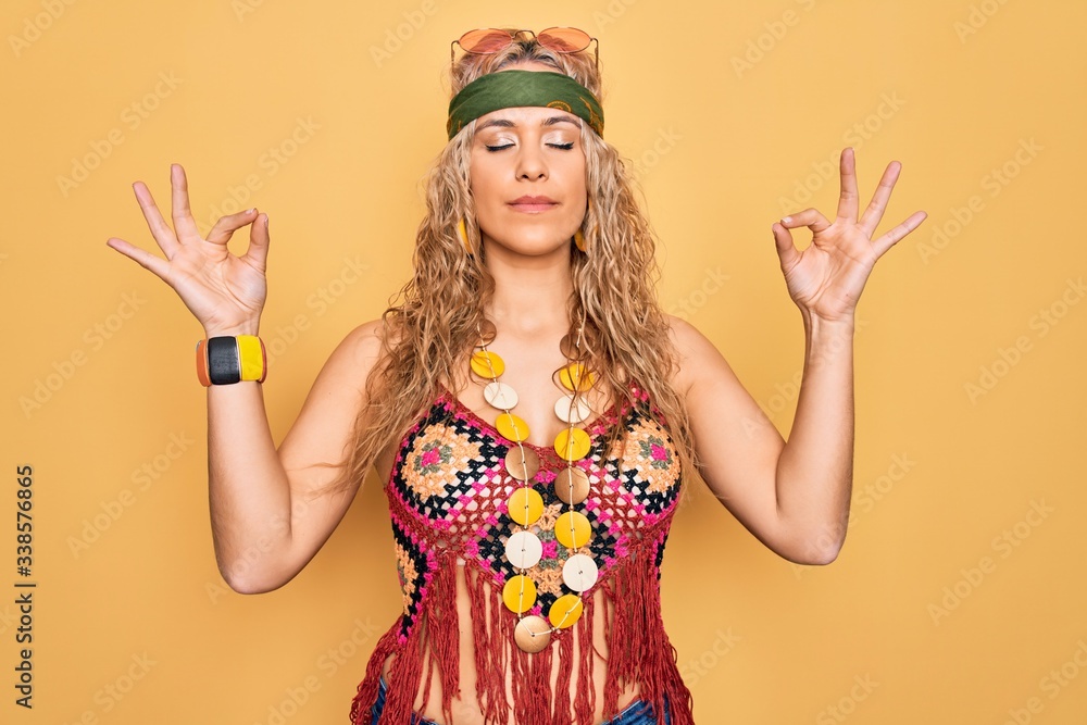 Beautiful blonde hippie woman wearing sunglasses and accessories over ...