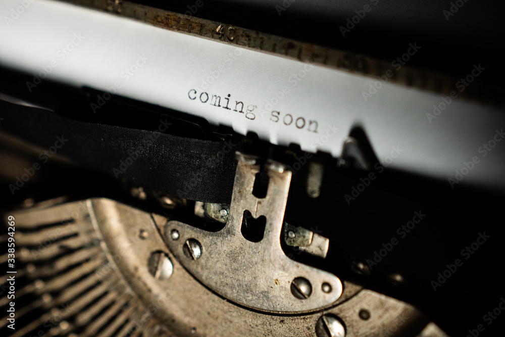 Typing "coming soon" on typewriter Stock Photo | Adobe Stock