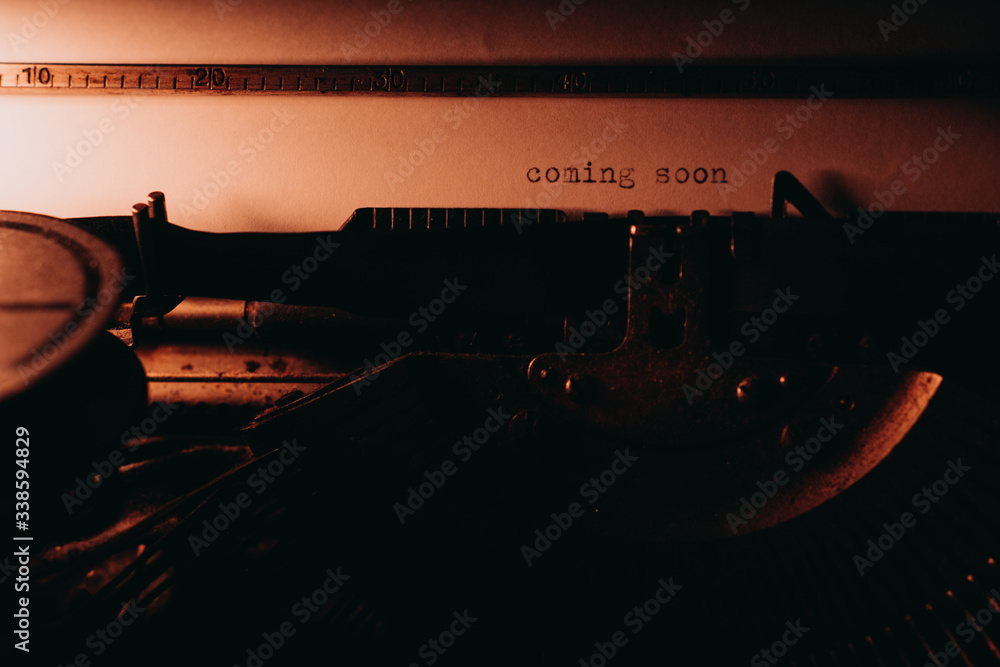 Typing "coming soon" on typewriter Stock Photo | Adobe Stock