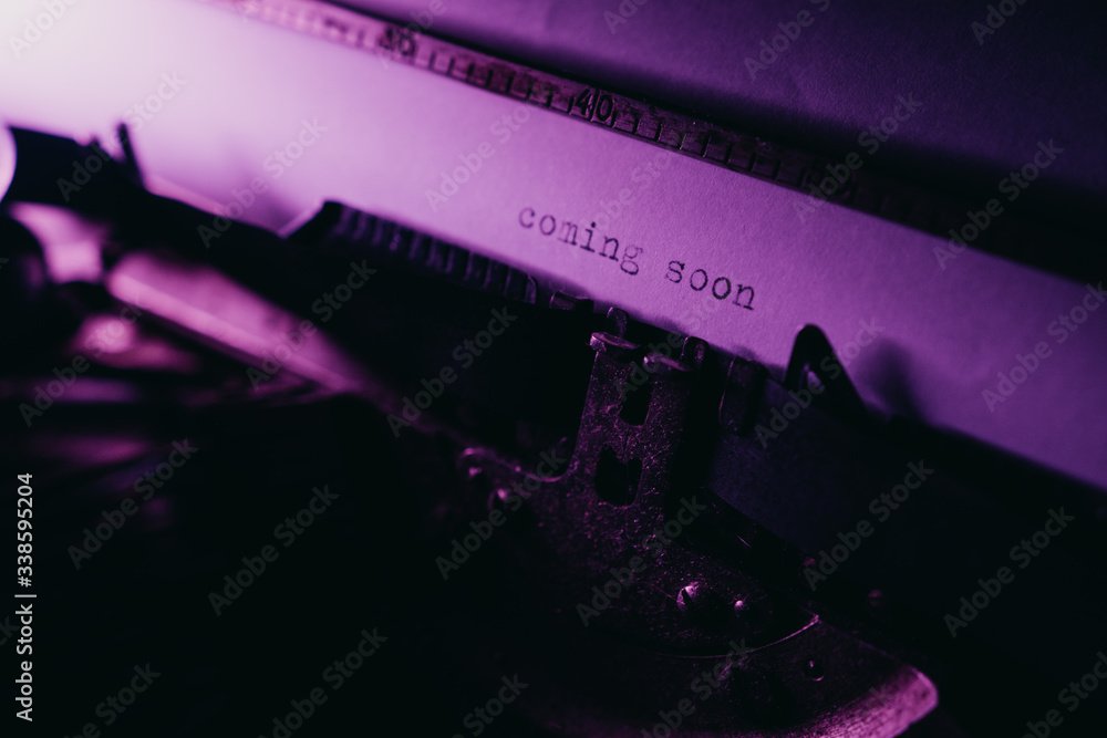 Typing "coming soon" on typewriter Stock Photo | Adobe Stock