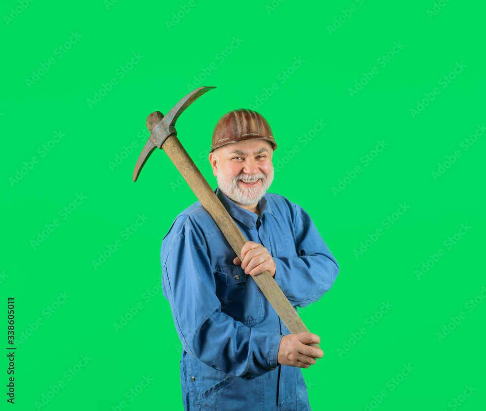 Foto de Man contractor with axe. Smiling workman with pickaxe ... Foto de Man contractor with axe. Smiling workman with pickaxe ...